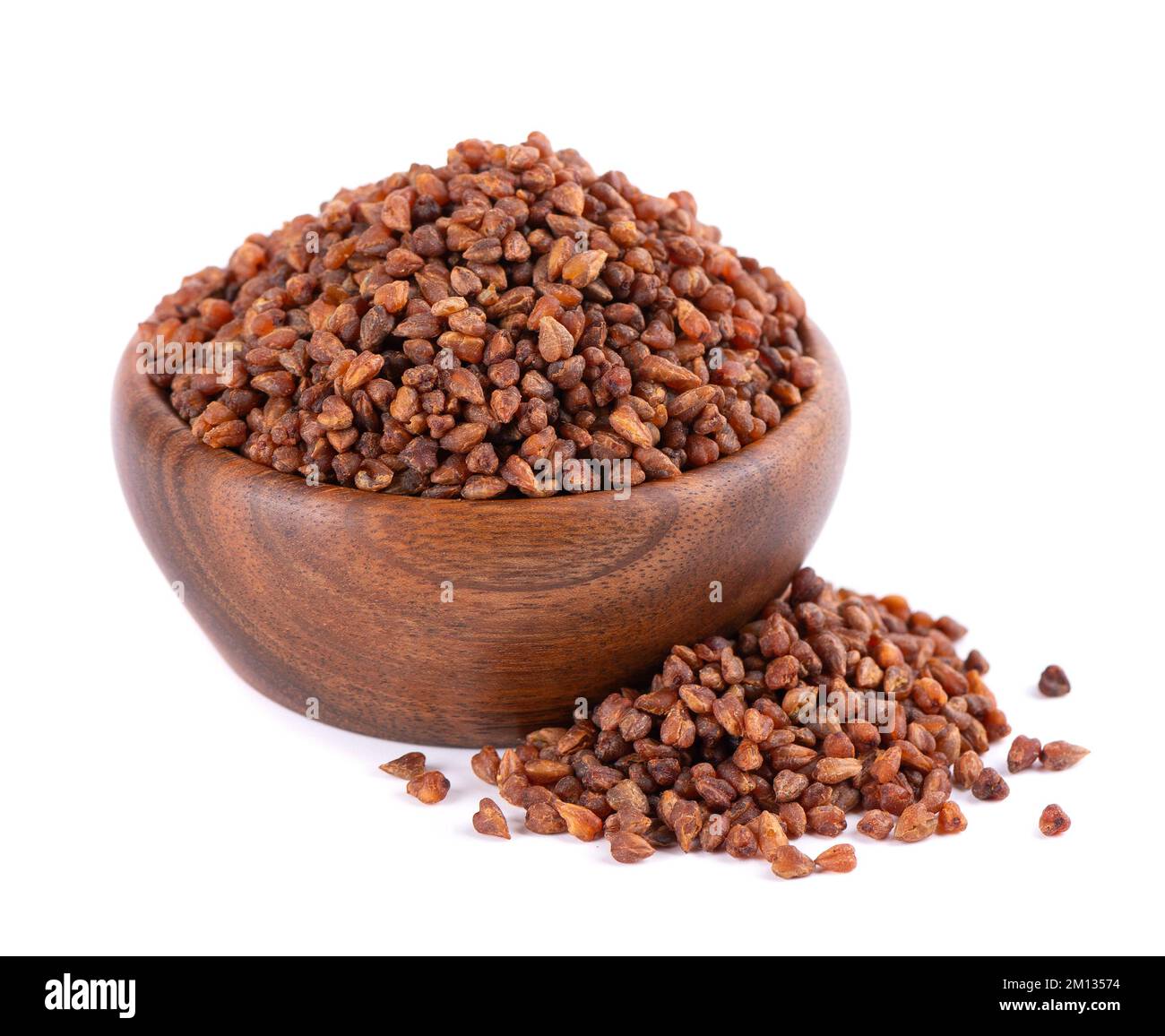 Buckwheat tea in wooden bowl, isolated on white background. Whole ...