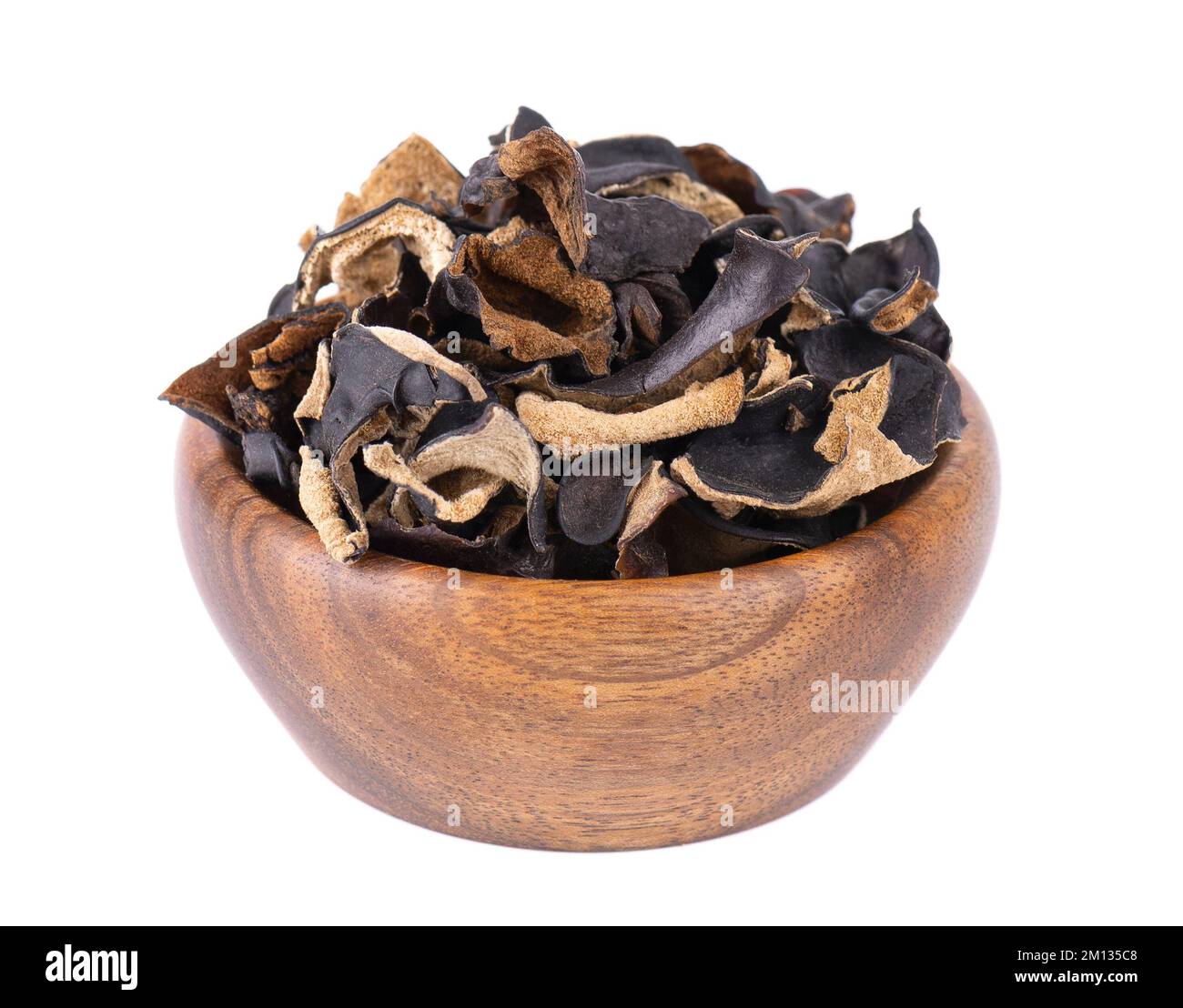 Dry black fungus in wooden bowl, isolated on white background. Chinese ...