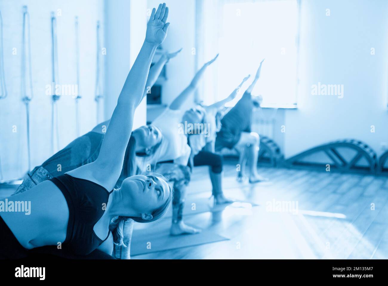 Yoga Class, Group of People Relaxing and Doing Yoga pose. Wellness and ...