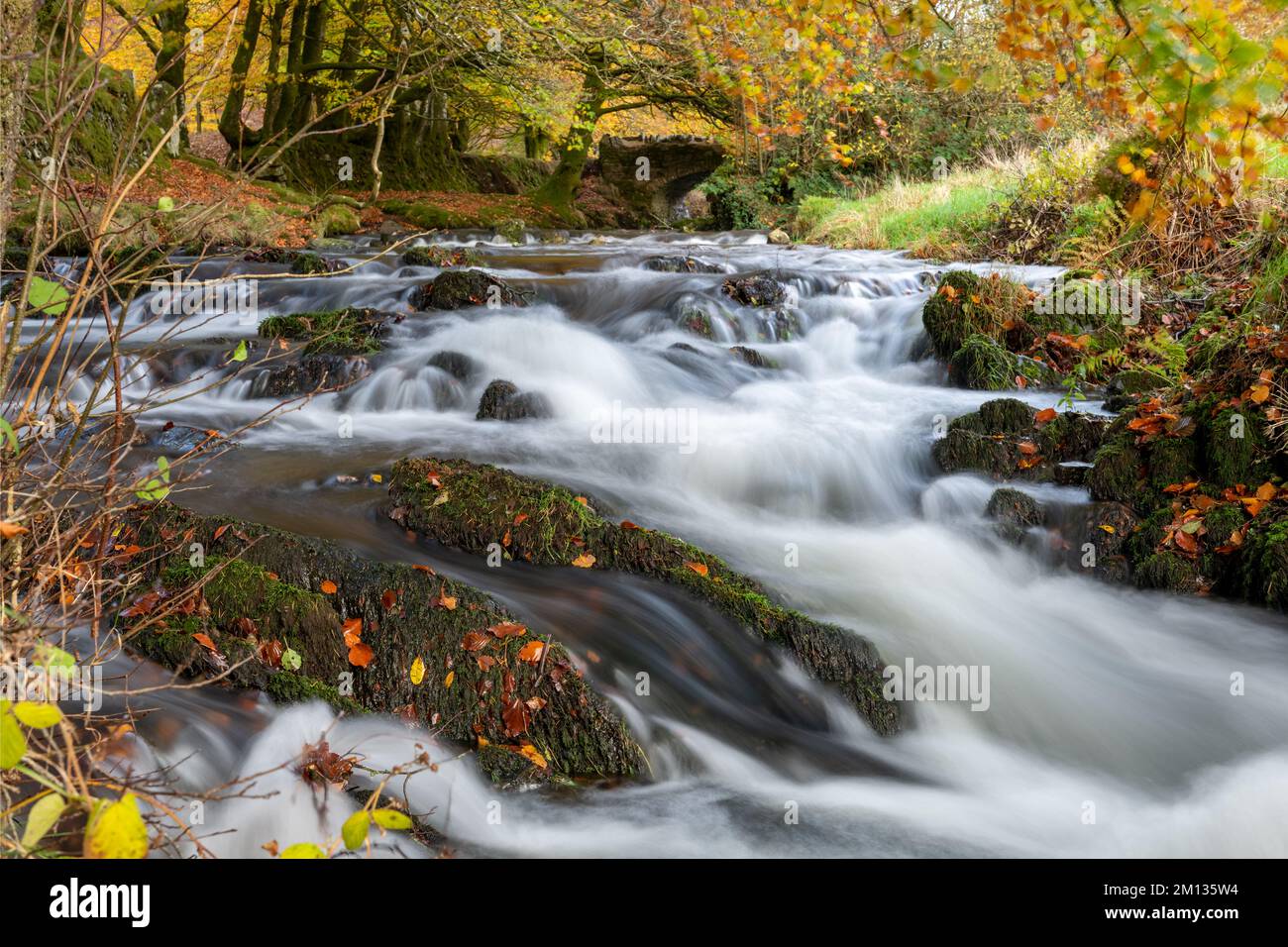 The Weir Water river flowing under Robbers Bridge in Exmoor National ...