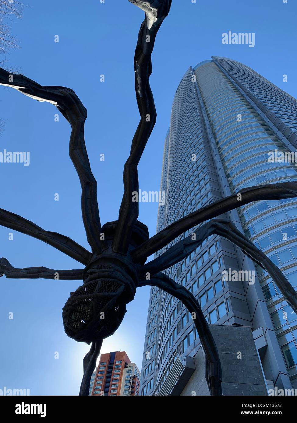 Large black spider structure in Japan CBD with clear blue skies Stock ...