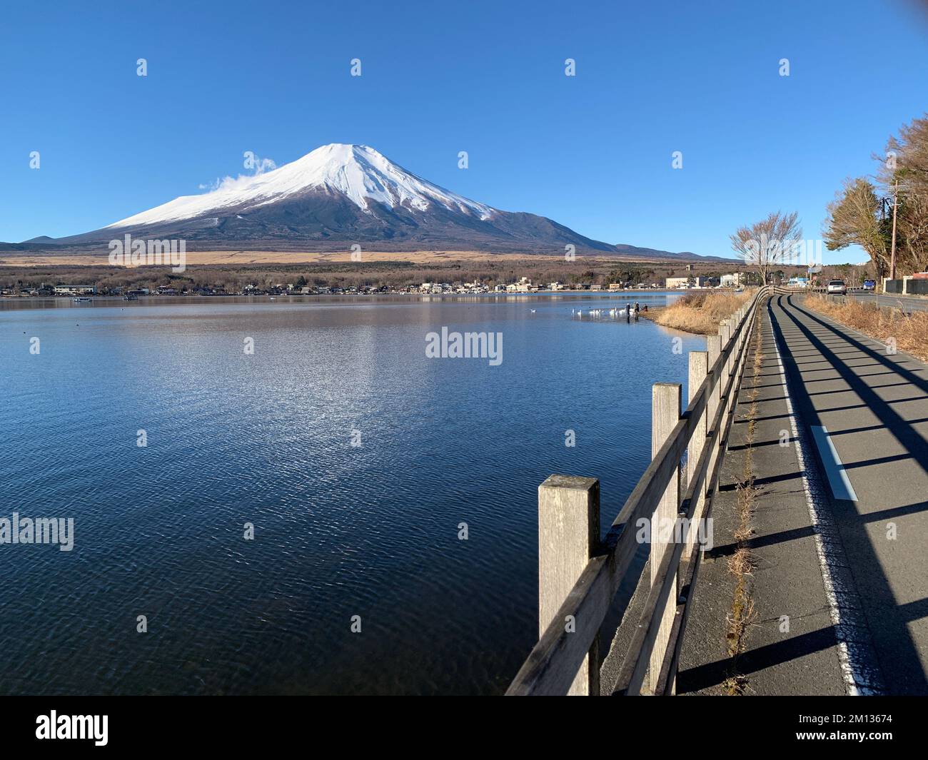 Mount Fuji in the backdrop with a road leading to it and with a clear ...