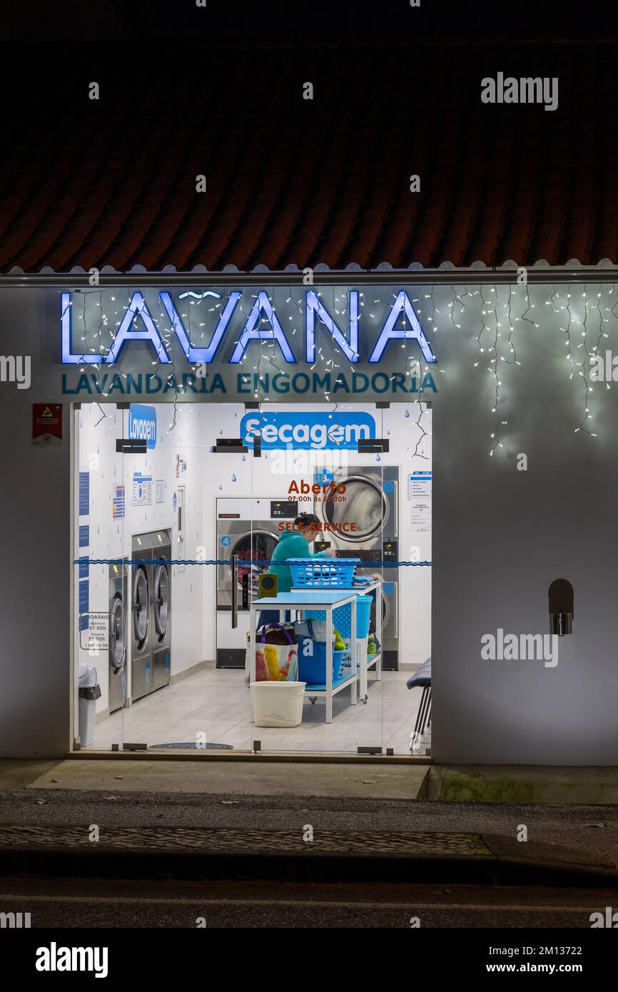 Laundry at night with Christmas lights Stock Photo - Alamy