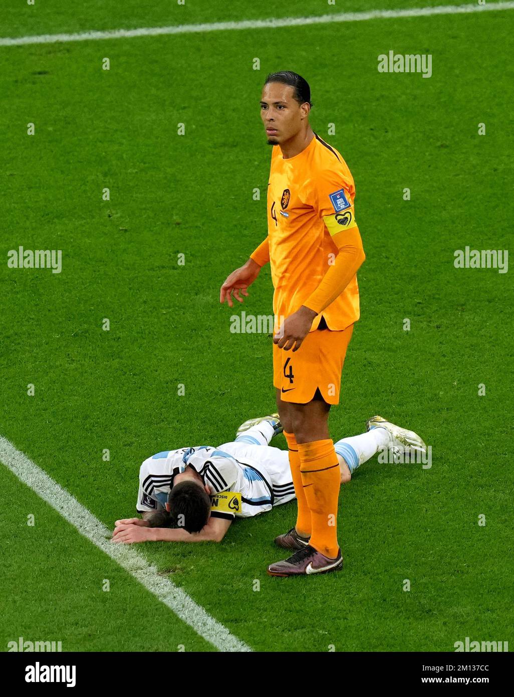 Argentina's Lionel Messi lies on the pitch after being fouled by ...