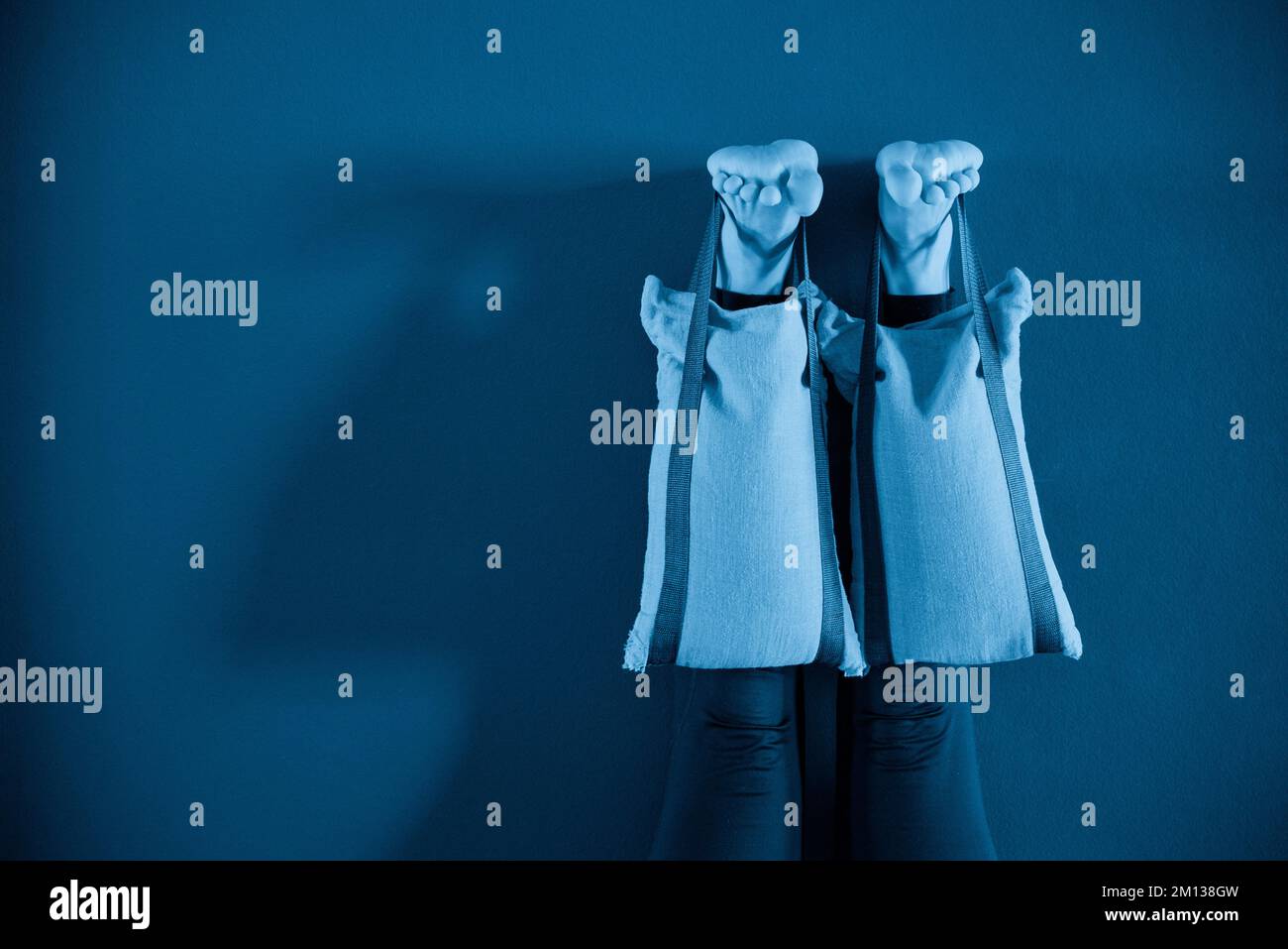 Woman legs up against wall hi-res stock photography and images - Alamy