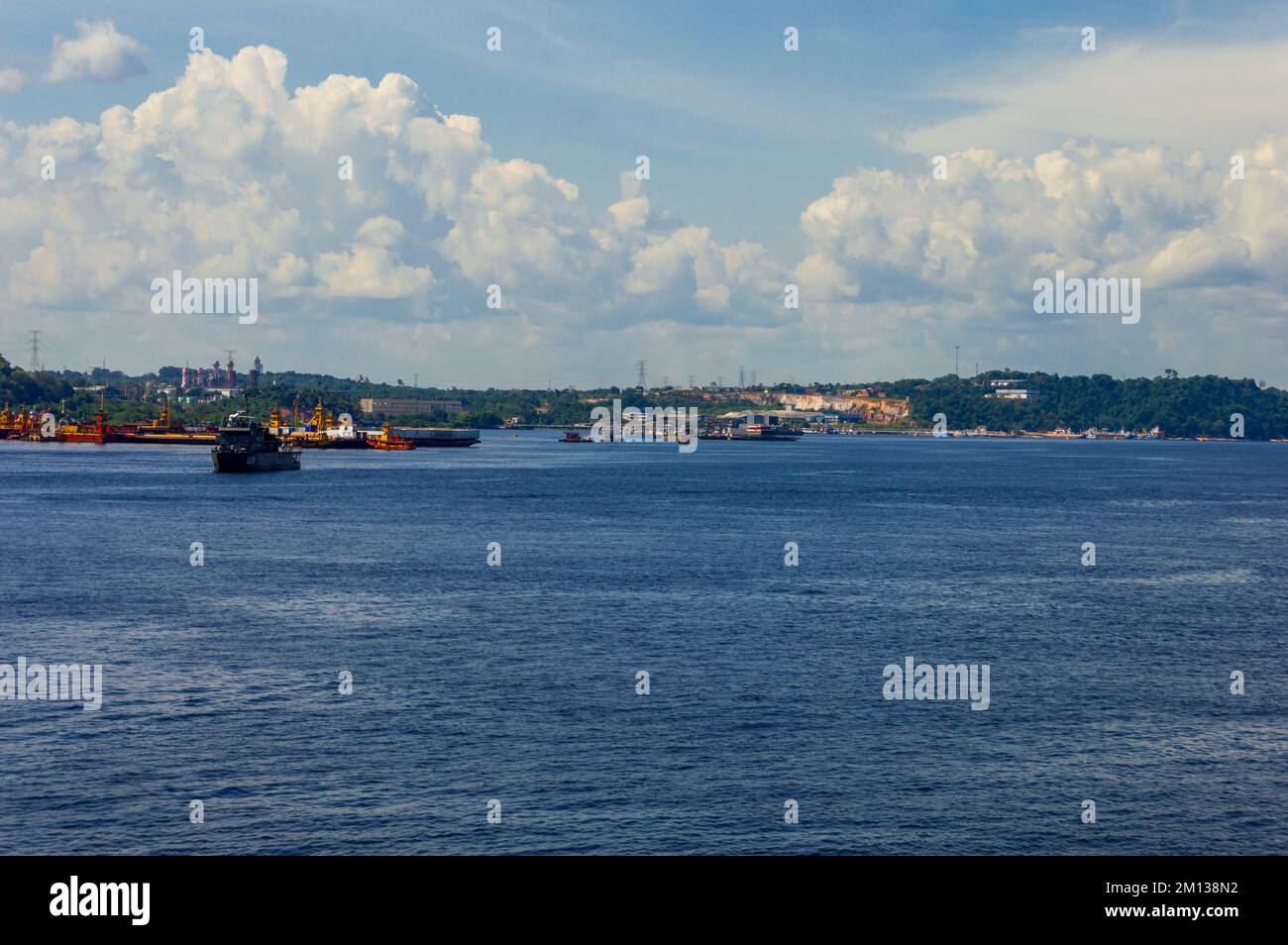 Industrial site on the river banks of Rio Amazonas in Brazil surrounded ...