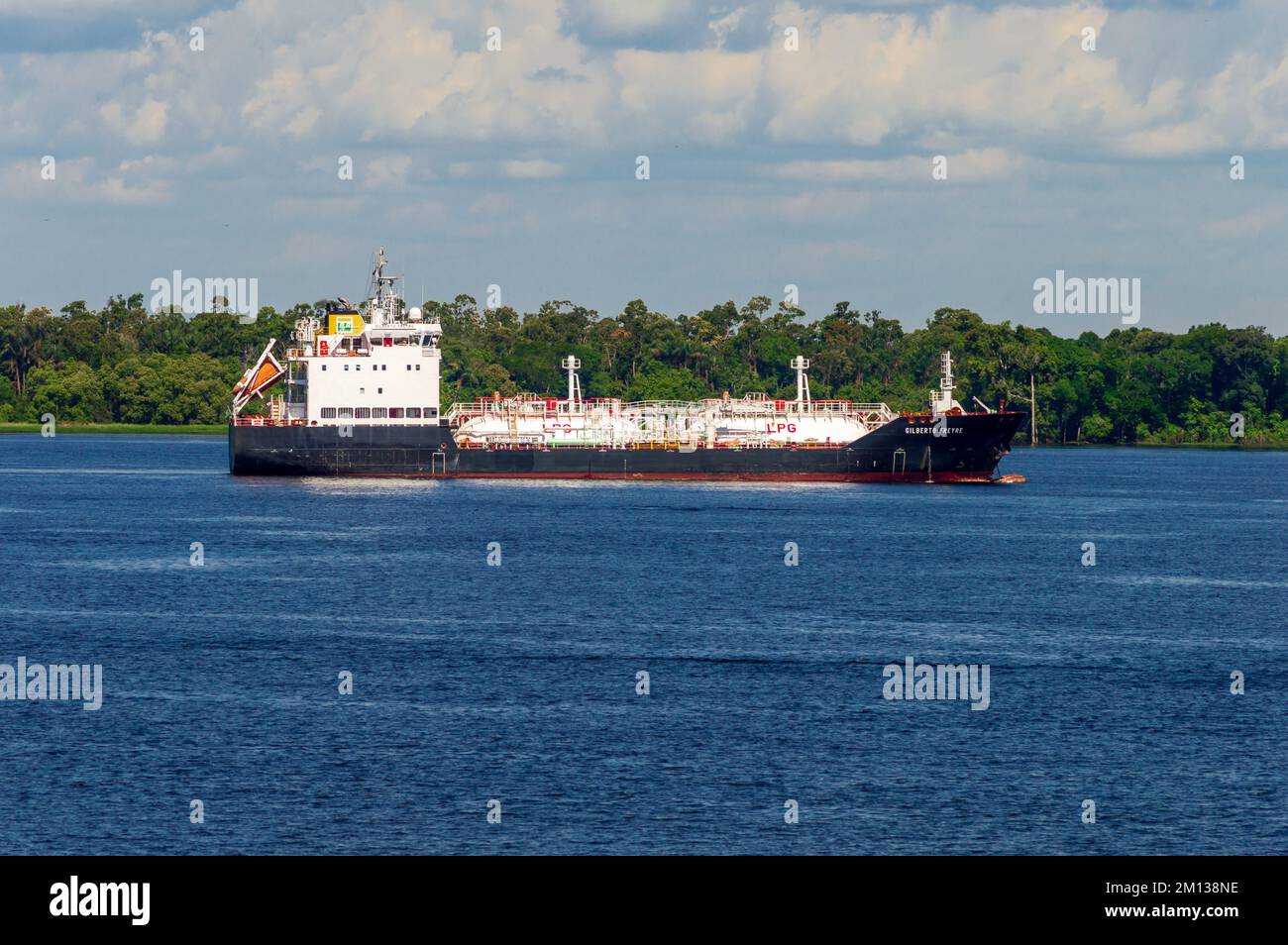 Cargo ships travelling along the Amazonas river in Brazil along the ...