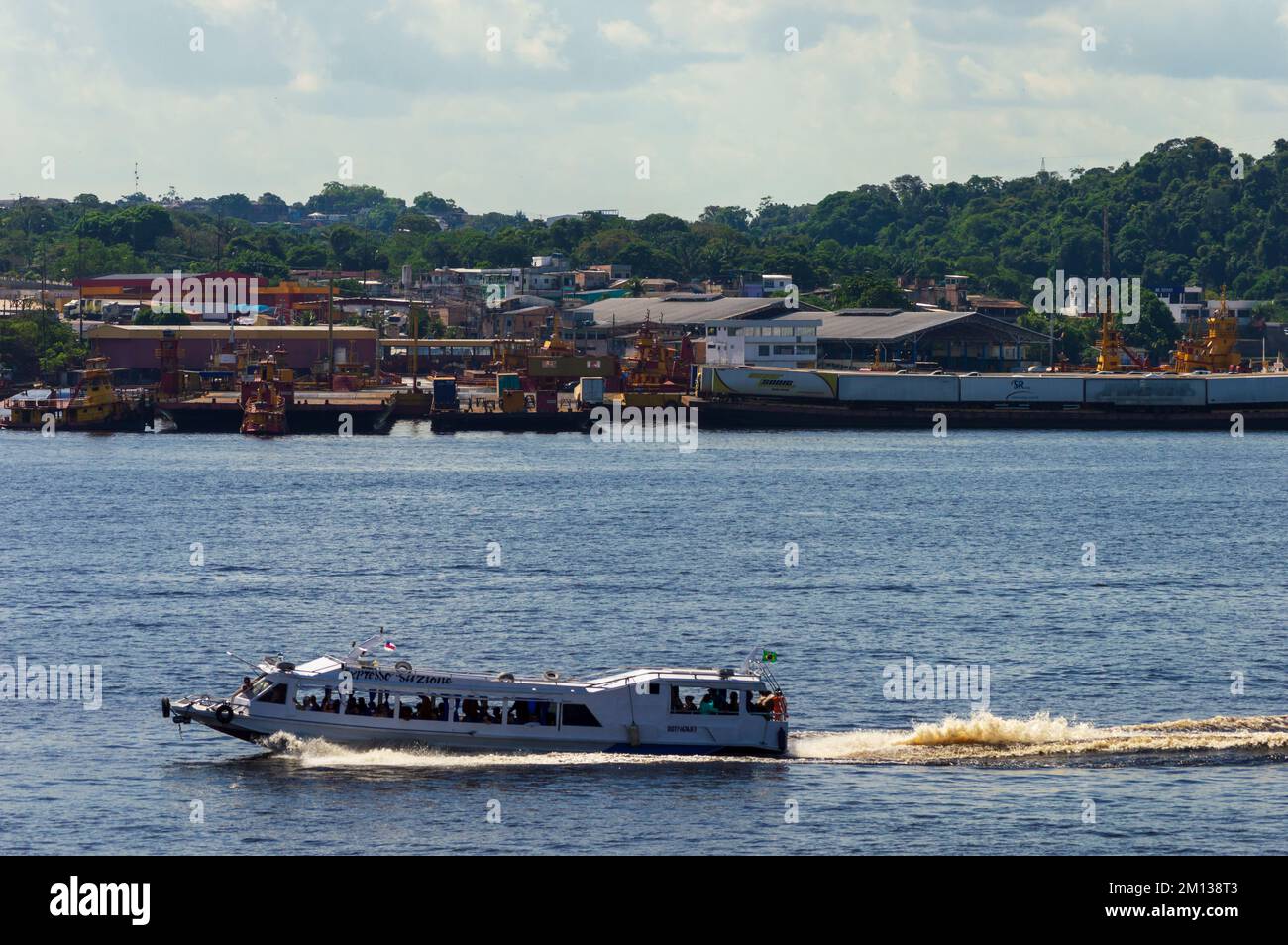 A cruise ship sailing on the Amazonas river in the middle of the amazon ...