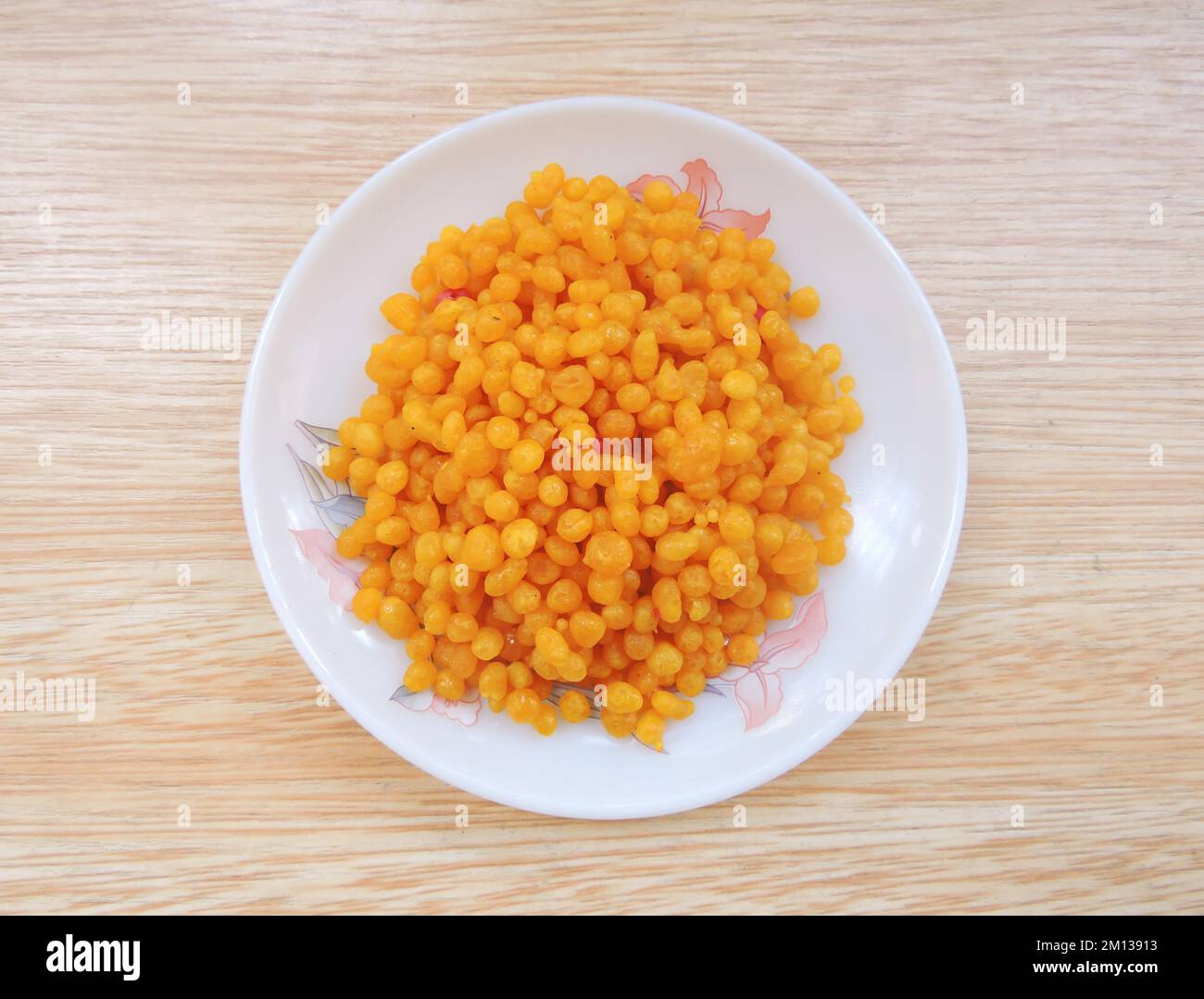 An Indian dessert made from sweetened, fried chickpea flour called ...