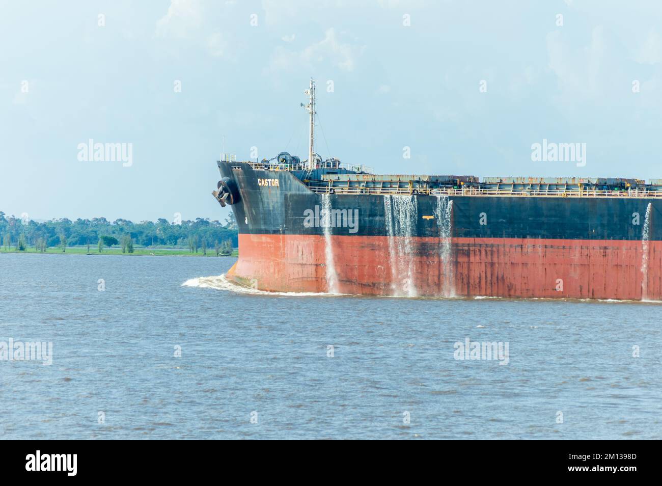 Cargo ships travelling along the Amazonas river in Brazil along the ...