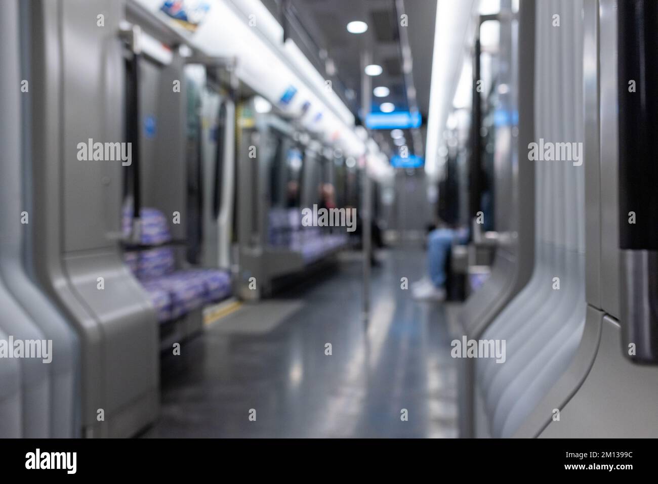 Blurred empty interior of a modern metro train, inside of an ...
