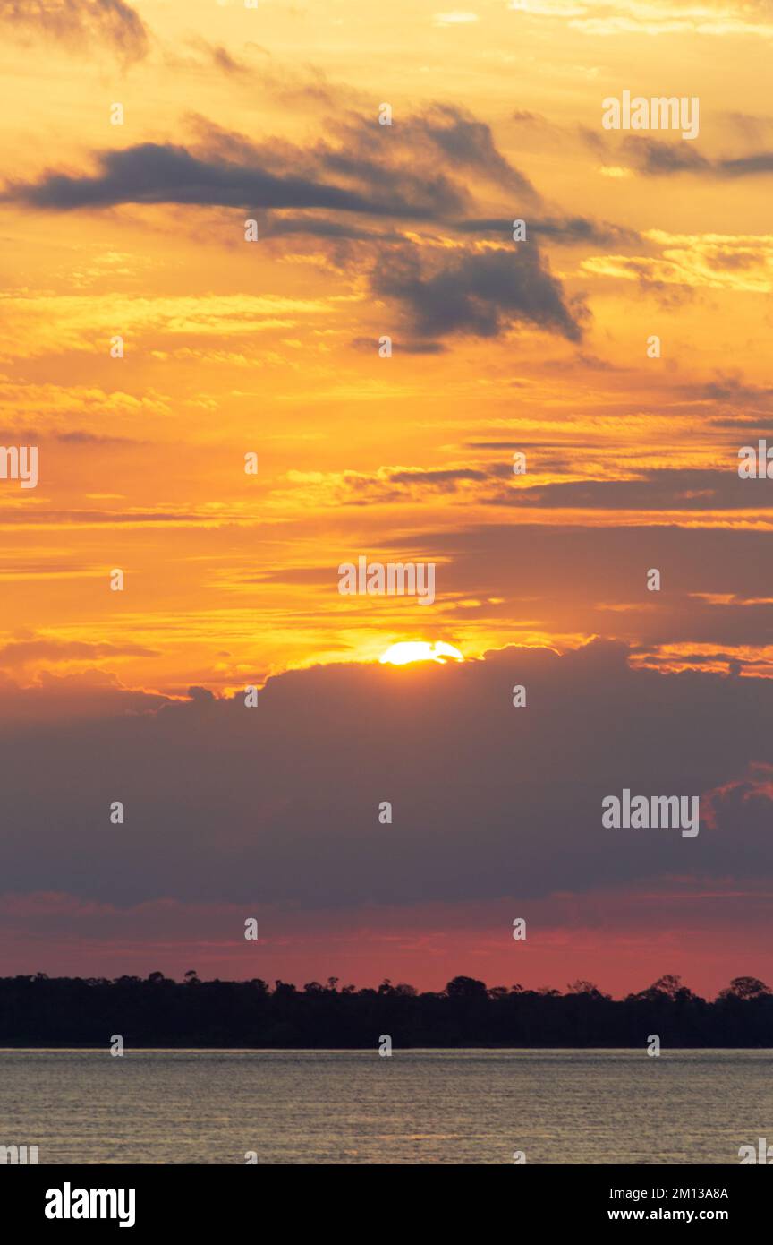 Amazing sunrise on the water of Amazon river in Brazil, nice soft warm ...