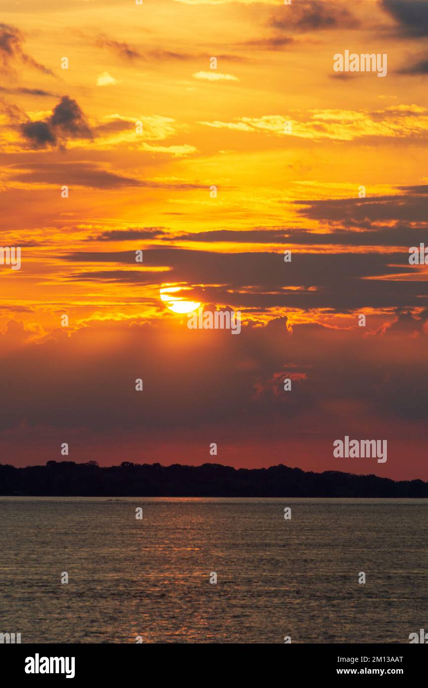 Amazing sunrise on the water of Amazon river in Brazil, nice soft warm ...