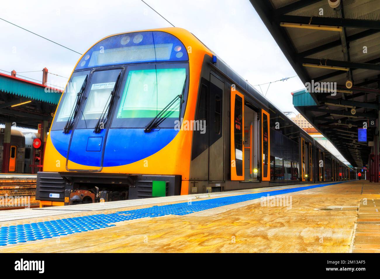 Overland passenger train at platform in Central station of Sydney with ...