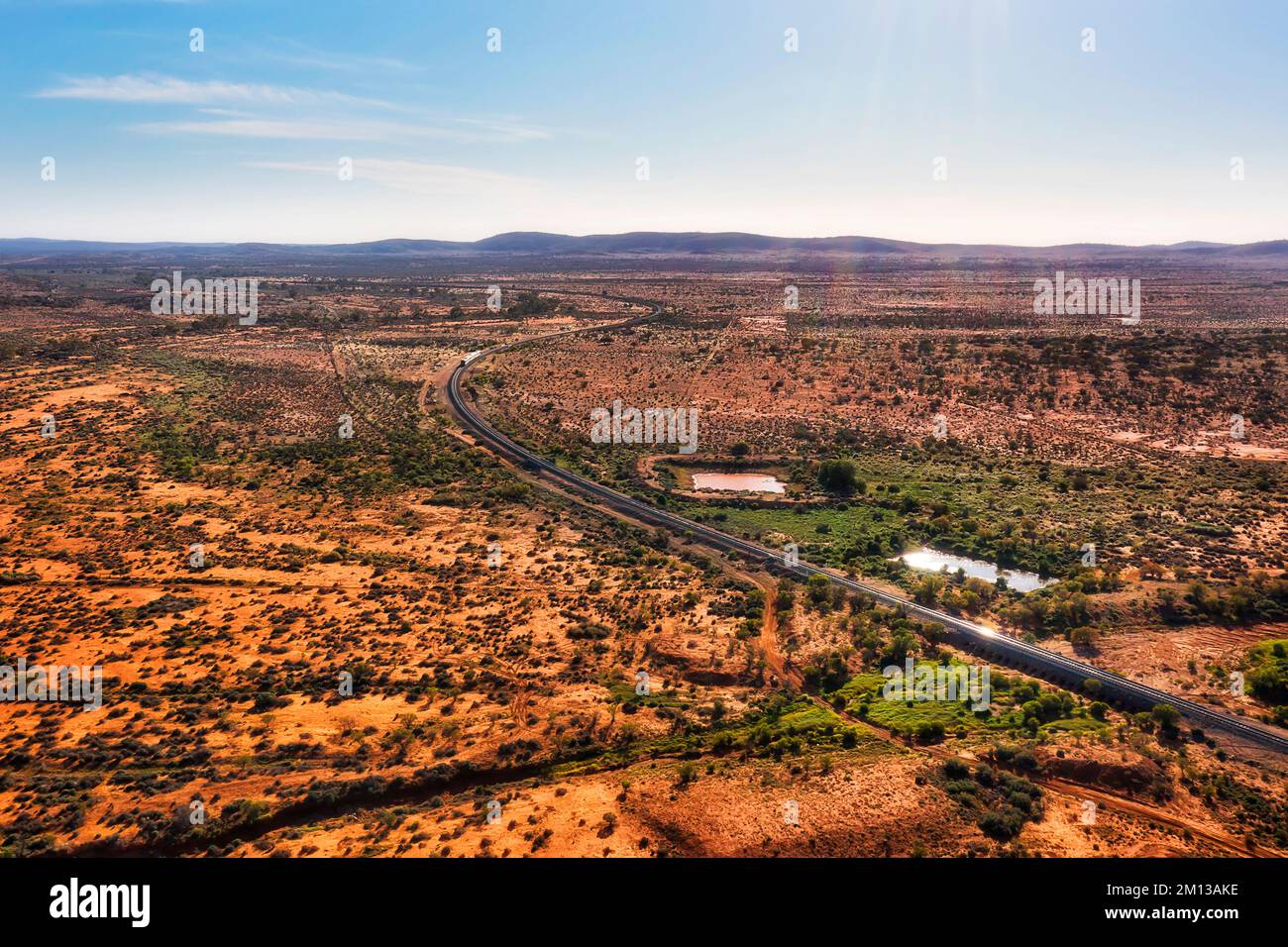 Aerial landscape of red soil australian outback with Train out of ...