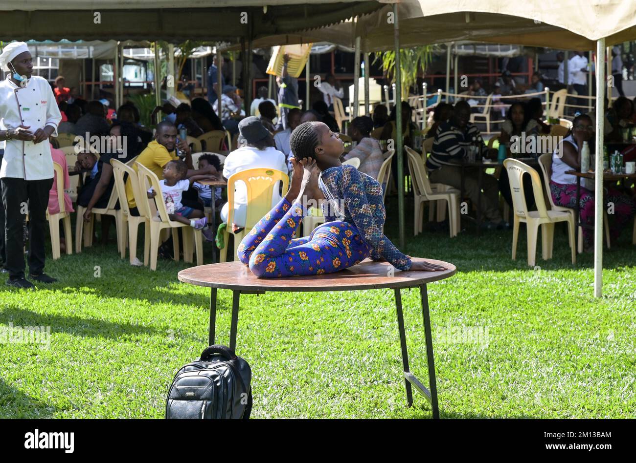 KENYA, Nairobi, middle class in beer garden, acrobatic performance ...