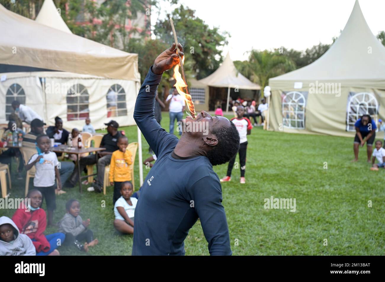 KENYA, Nairobi, middle class in beer garden, acrobatic performance ...
