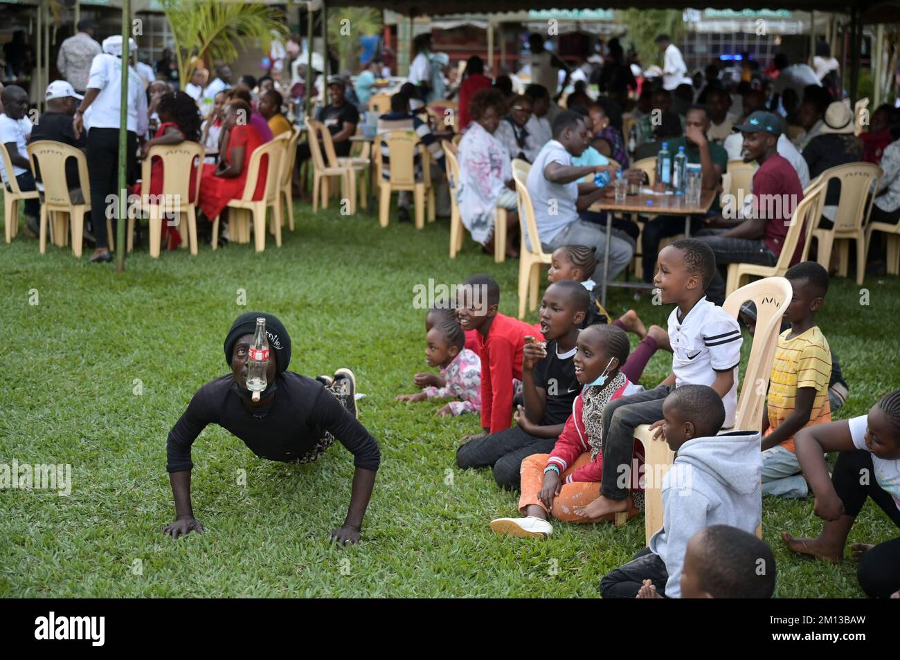 KENYA, Nairobi, middle class in beer garden, acrobatic performance ...