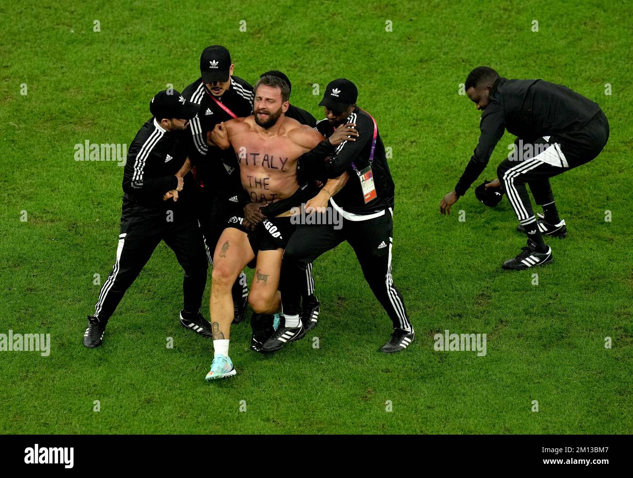 Security remove a pitch invader during the FIFA World Cup Quarter-Final ...