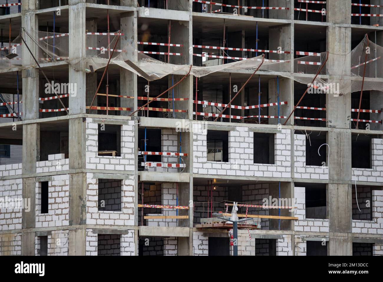 Facade of a multi-storey building under construction, urban development ...