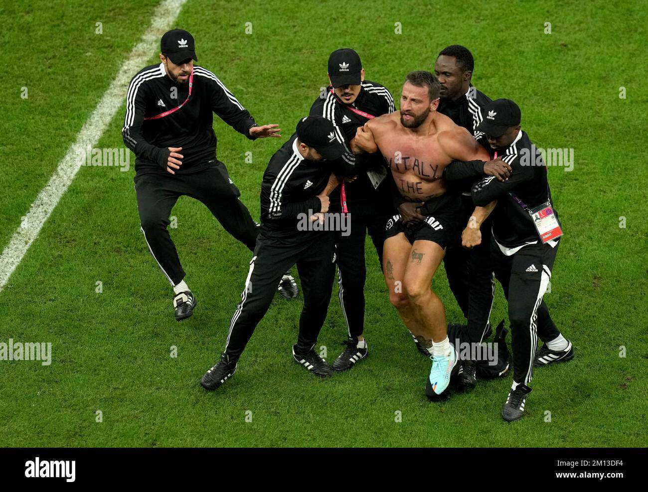 Security remove a pitch invader during the FIFA World Cup Quarter-Final ...