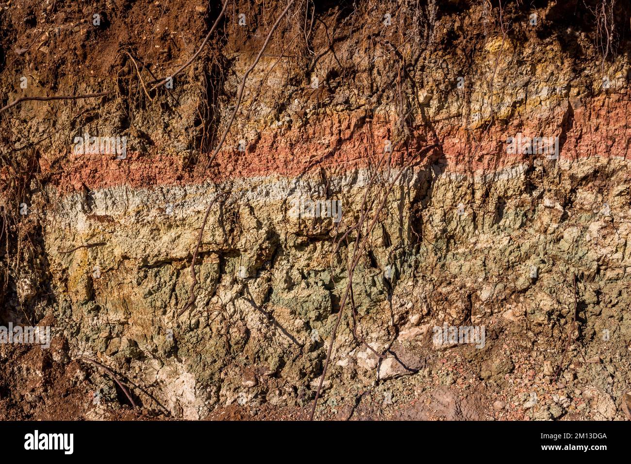 Clay layer folded in layers of different colors dried in the sun Stock ...