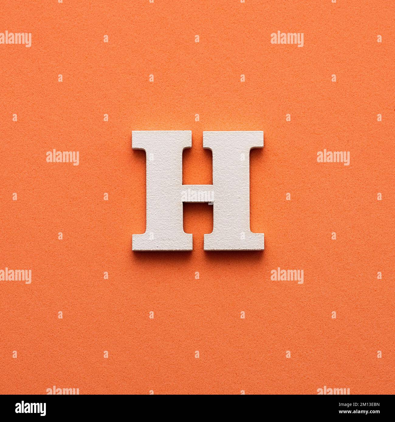 Alphabet letter H - White wooden letter on pink background Stock Photo ...
