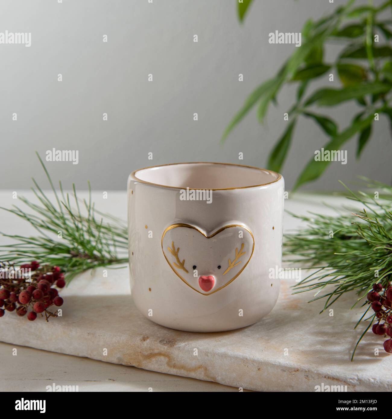 christmas decorated hand made ceramic coffee mug with pine leafs Stock ...