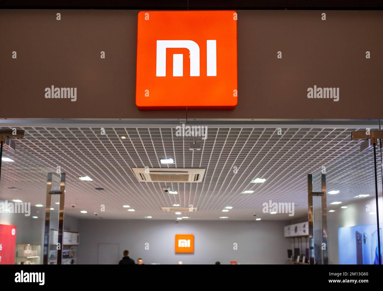 Xiaomi Mi store. Signboard logo above entrance to store. Xiaomi Inc ...