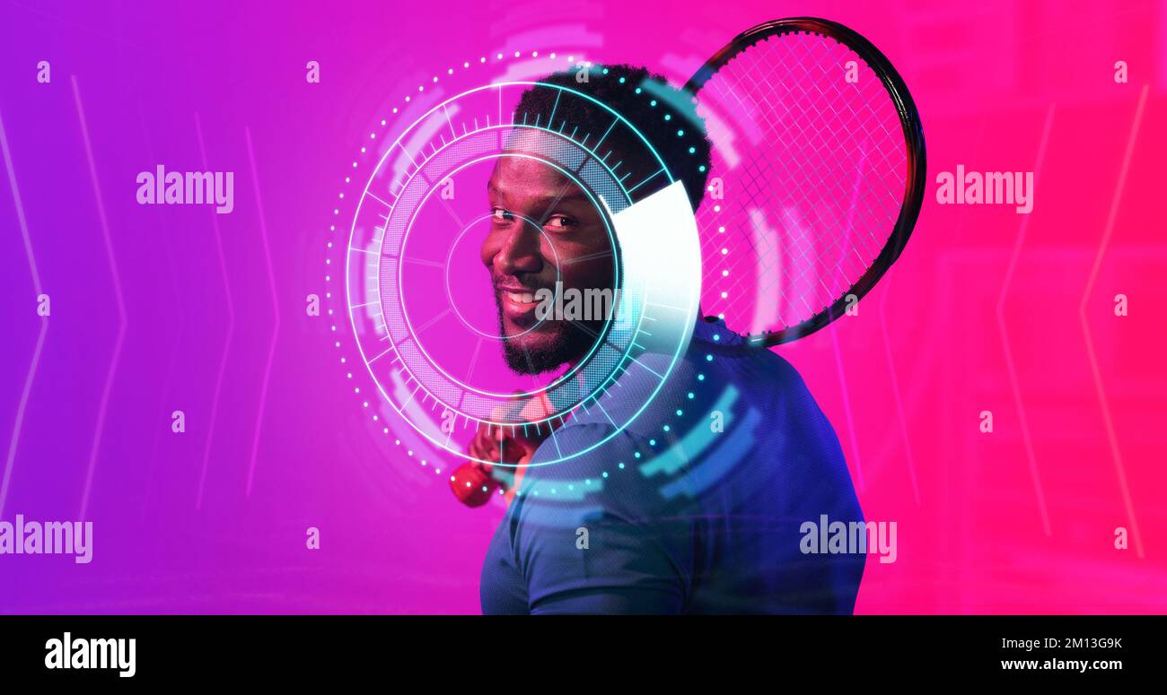 Smiling african american male tennis player with racket holding ...