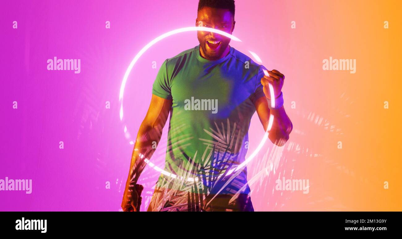 African american male tennis player screaming and shaking arm by ...