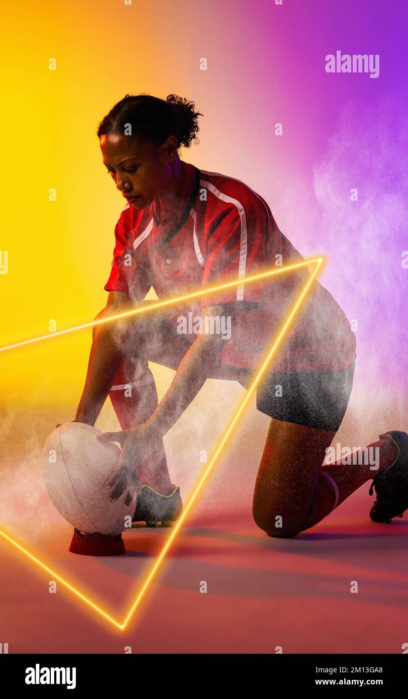 Illuminated triangle over biracial female rugby player with ball ...