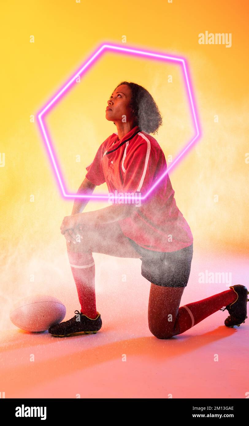 Composite of biracial female rugby player kneeling over illuminated ... Composite of biracial female rugby player kneeling over illuminated ...