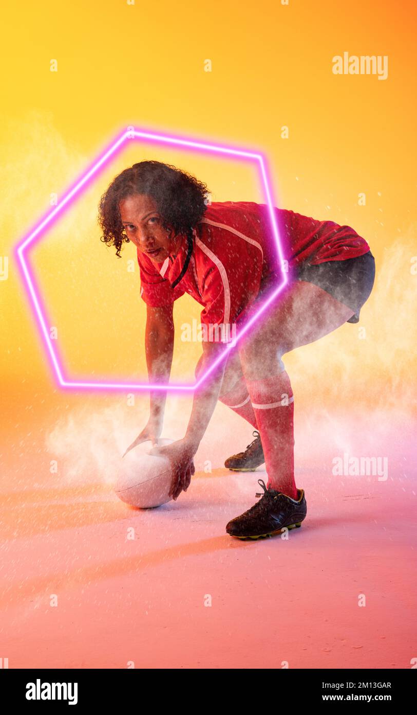 Composite of biracial female rugby player with ball bending amidst ...