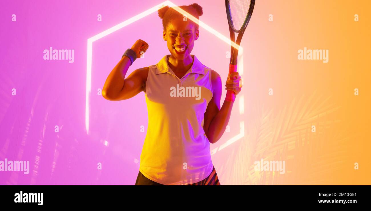 African american female tennis player holding racket and shaking fist ...