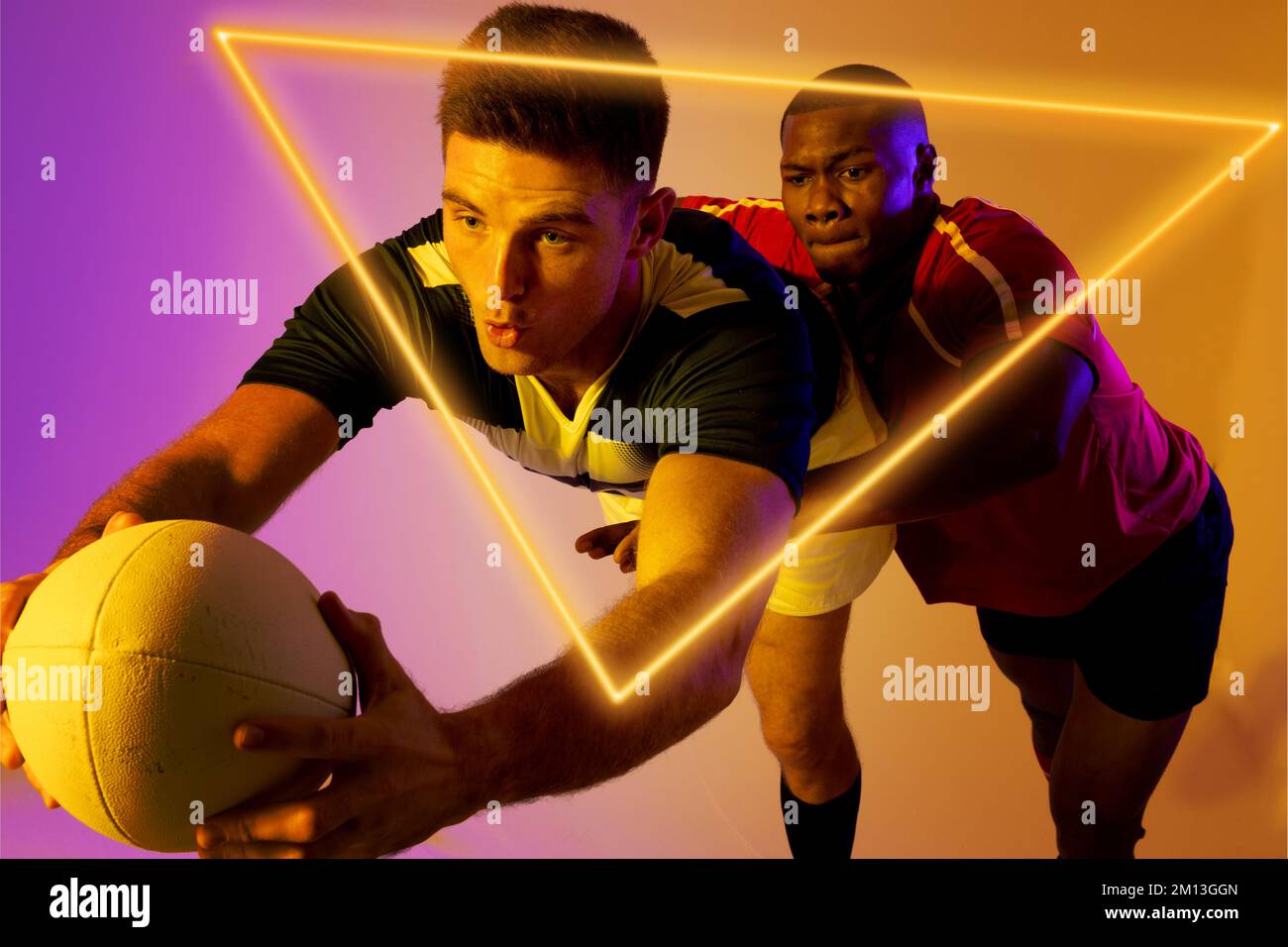 Illuminated triangle over diverse rugby male players chasing ball over ...