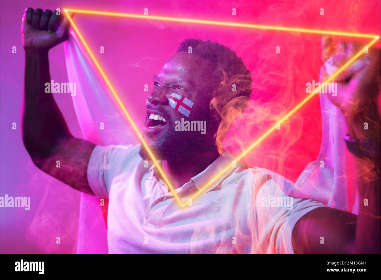 African american male fan with england flag and face paint screaming by ...