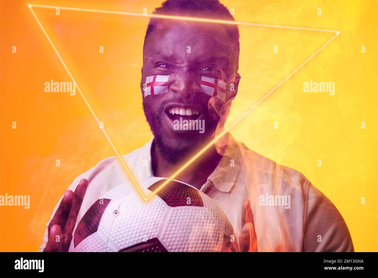 African american male fan with ball and england flag's face paint ...