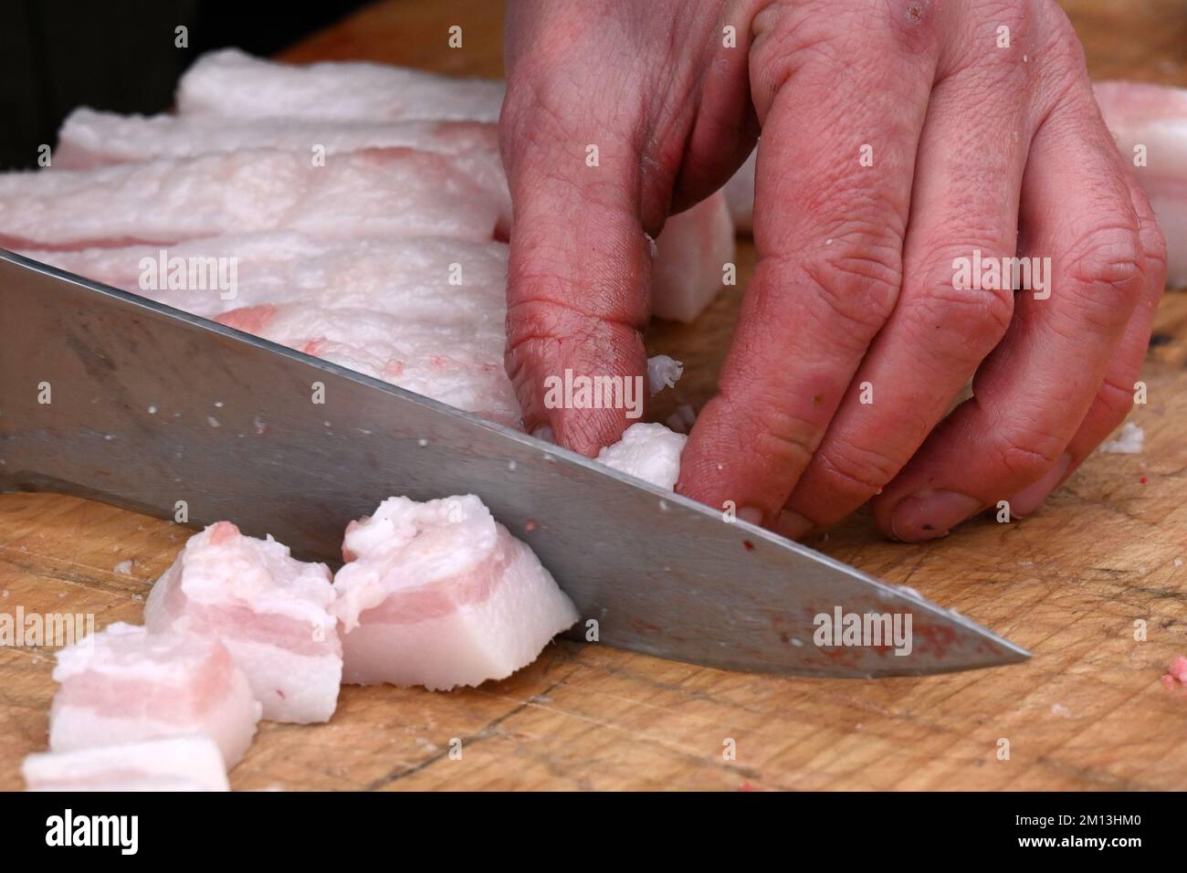 Butcher cutting meat outdoors hi-res stock photography and images - Alamy