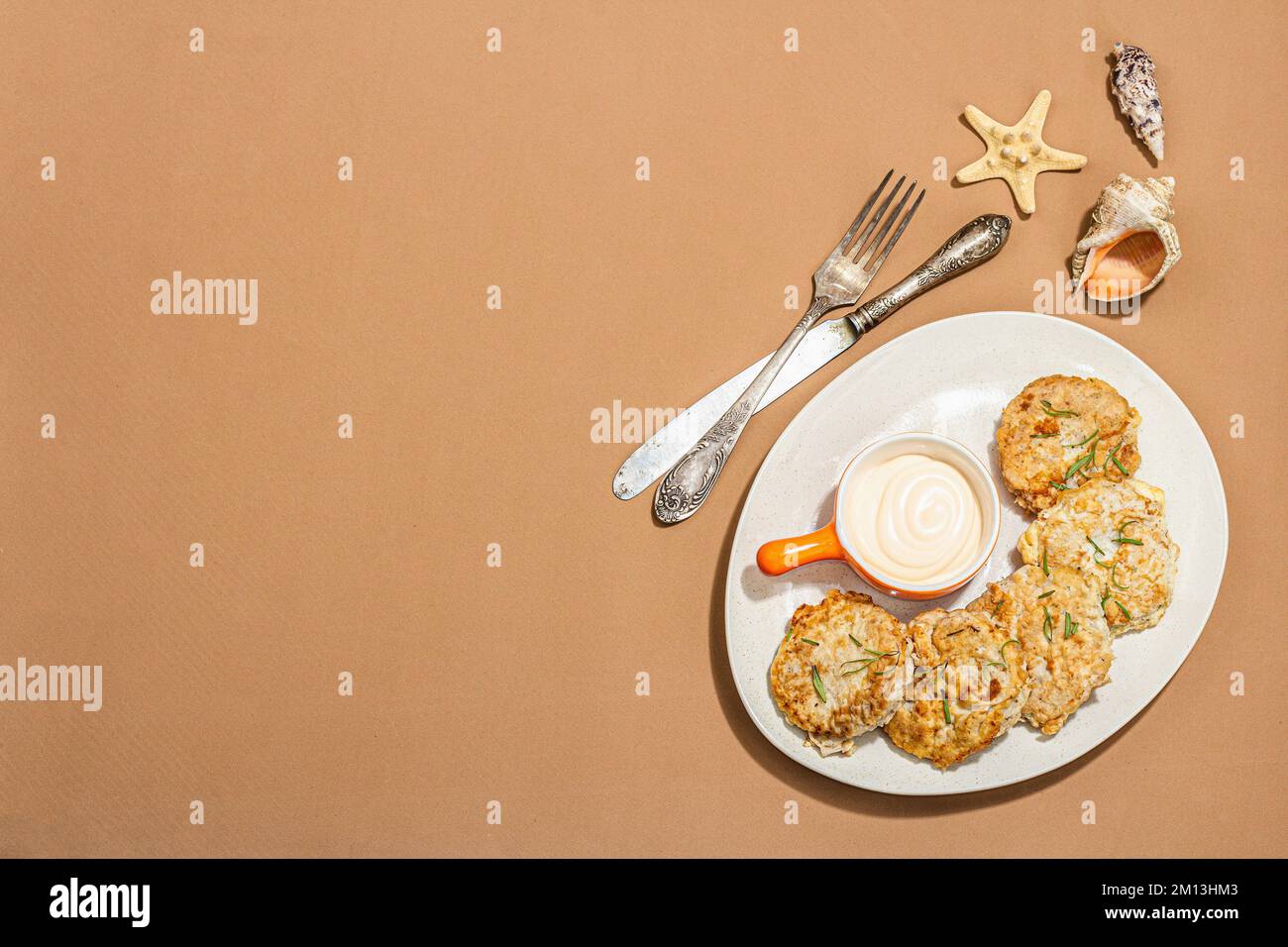 Hake fillet fried in batter. Sauce, fresh rosemary. Vegetarian healthy ...