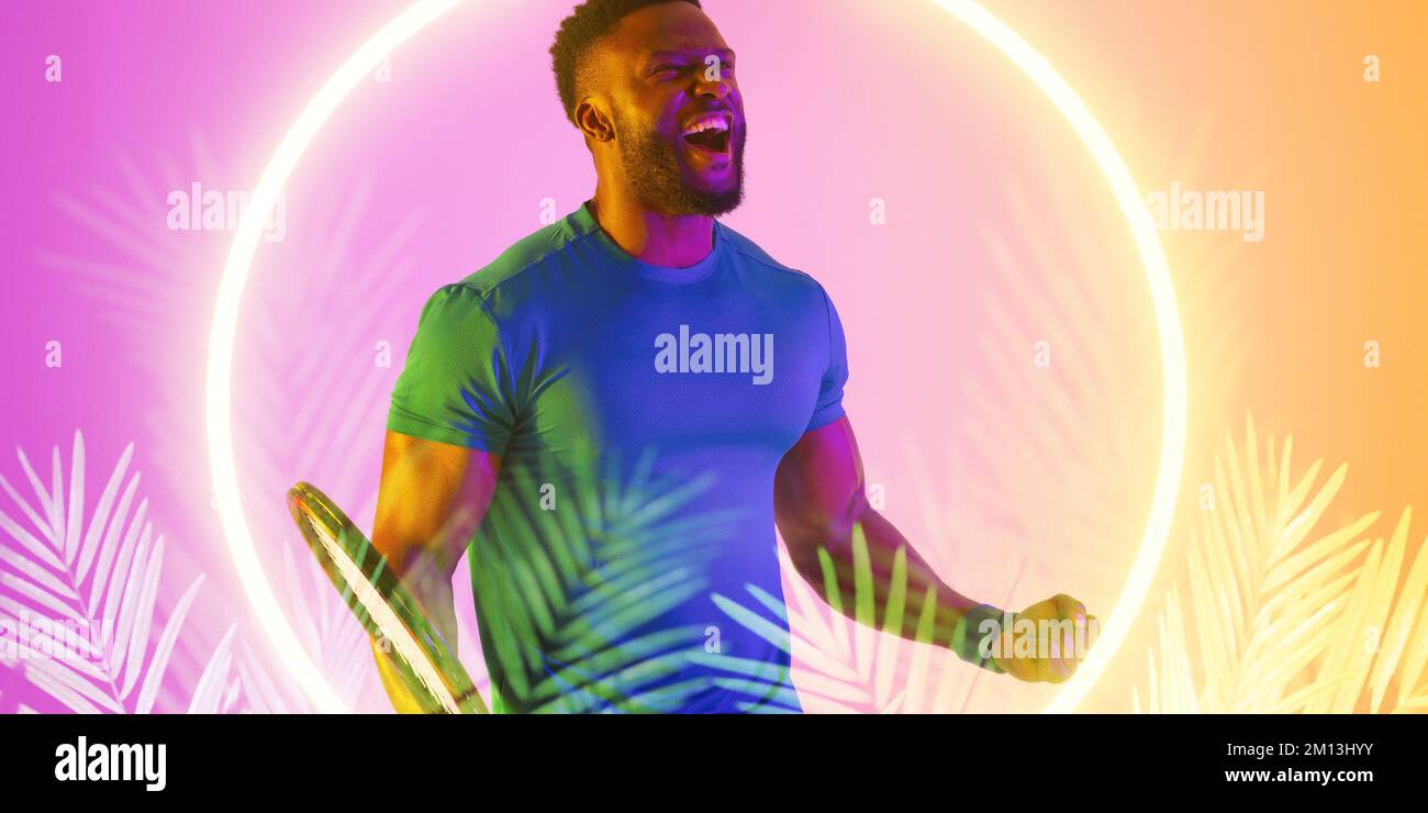 Cheerful african american male player with racket screaming over ...