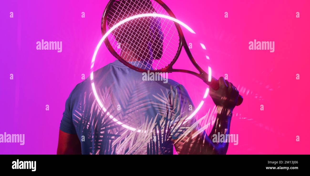 Illuminated plants and circle over rear view of african american male ...