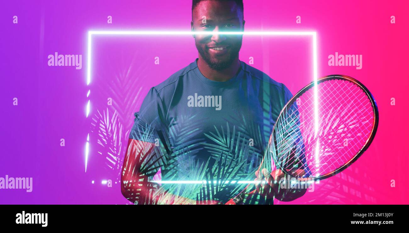 Illuminated plants and rectangle over smiling african american male ...