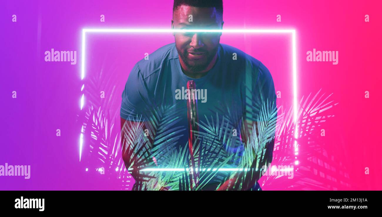 Illuminated plants and rectangle over african american male tennis ...