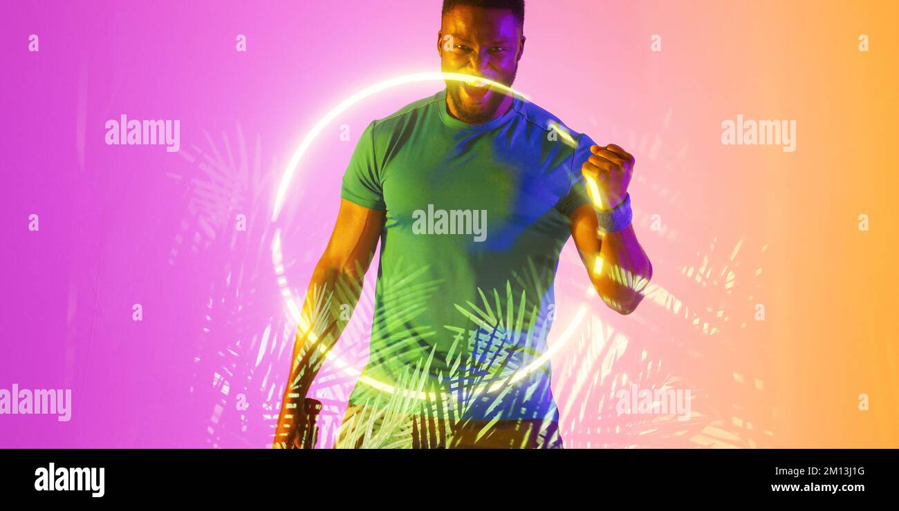 Cheerful african american male player screaming and shaking fist over ...