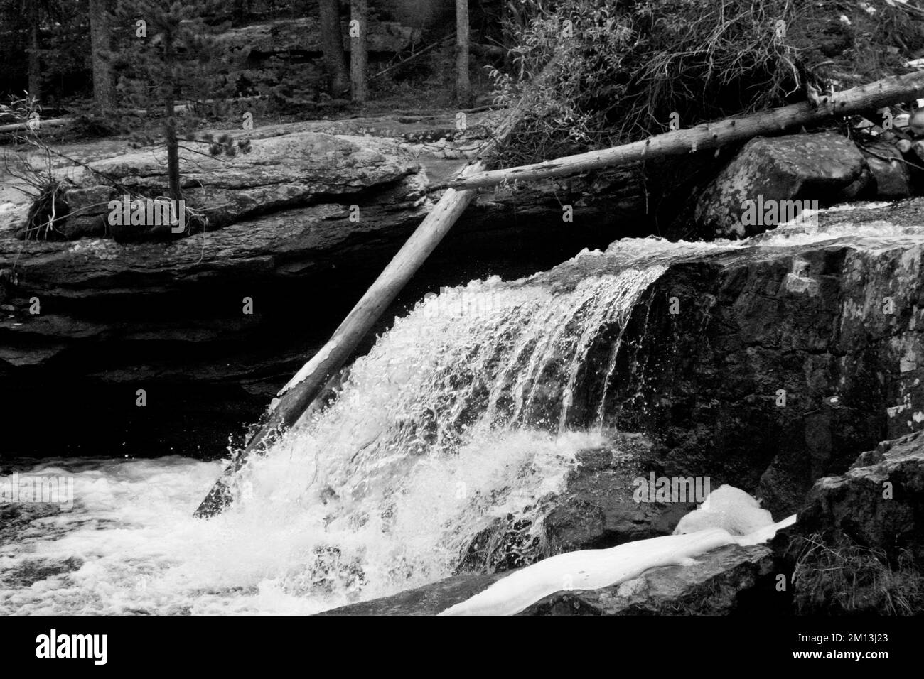 A snowmelt waterfall in the Rocky Mountains Stock Photo - Alamy