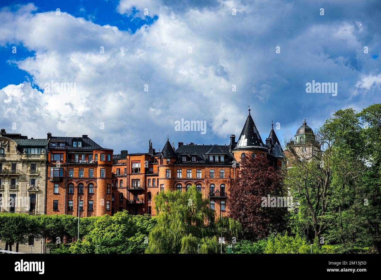 Low angle view of buildings against cloudy sky Stock Photo - Alamy