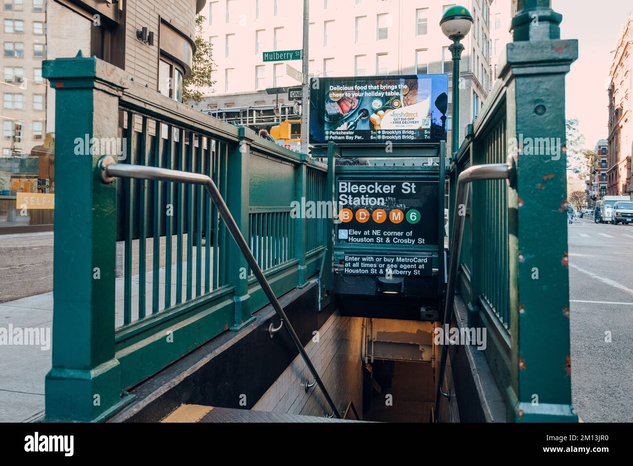 New York, USA - November 21, 2022: Entrance and stairs down to Bleecker ...