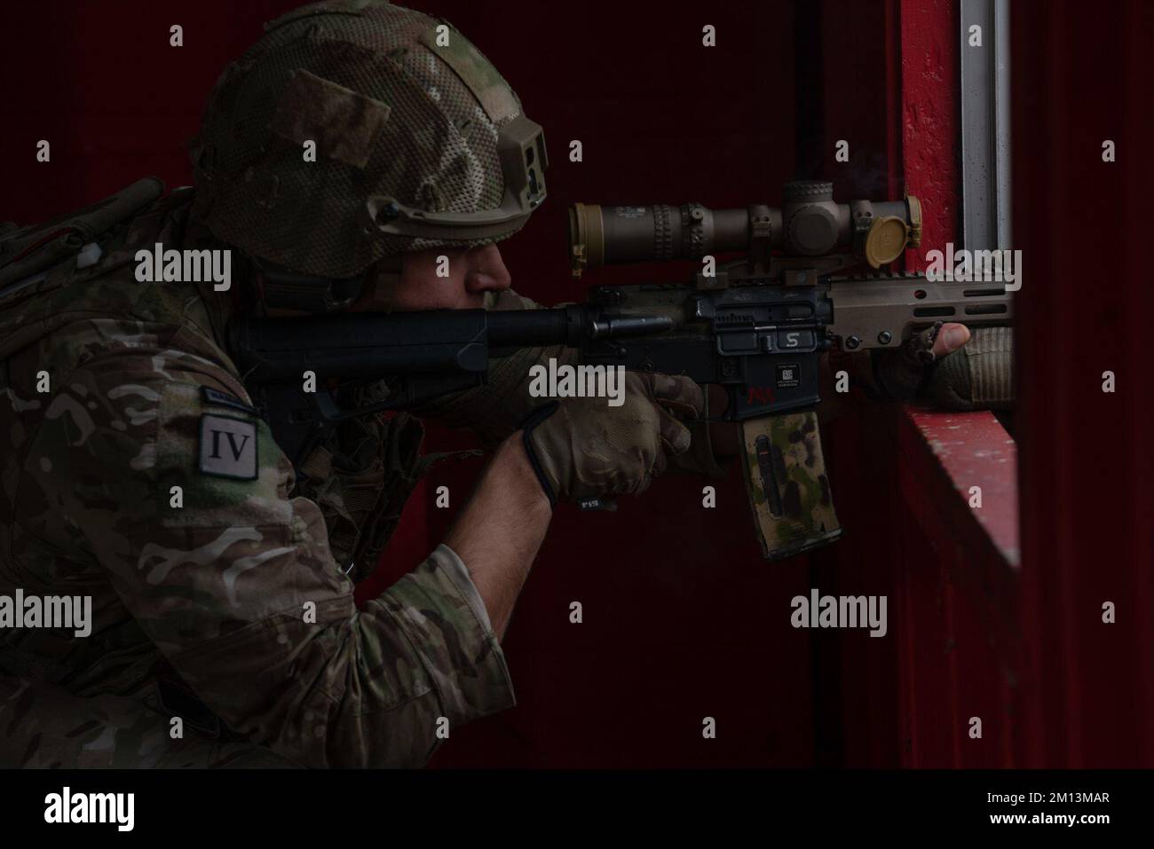 A Ranger assigned to the United Kingdom’s 4th Ranger Battalion, fires ...