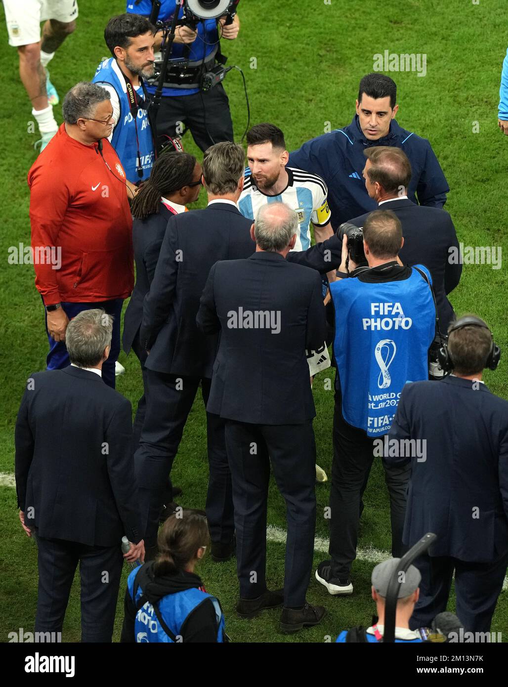 Argentina's Lionel Messi (right) speaks with Netherlands coach Edgar ...